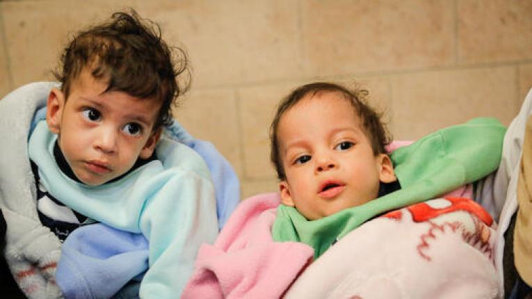 Separated conjoined twins return to Yemen following surgery in Jordan ...